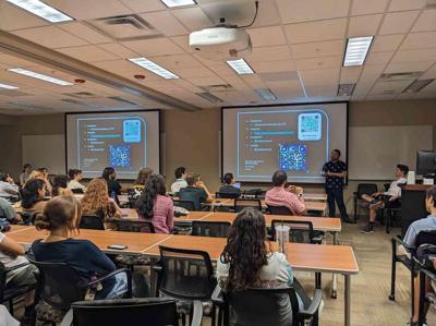 Planetarium director engages students in an astronomical discussion ...
