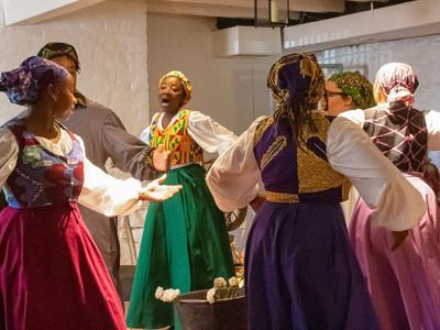 UNC Charlotte dance and music students perform a Ring Shout, a ...