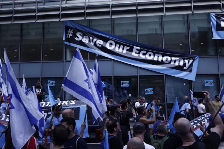 Israeli anti-government protesters hit stock market, roads and trains ...