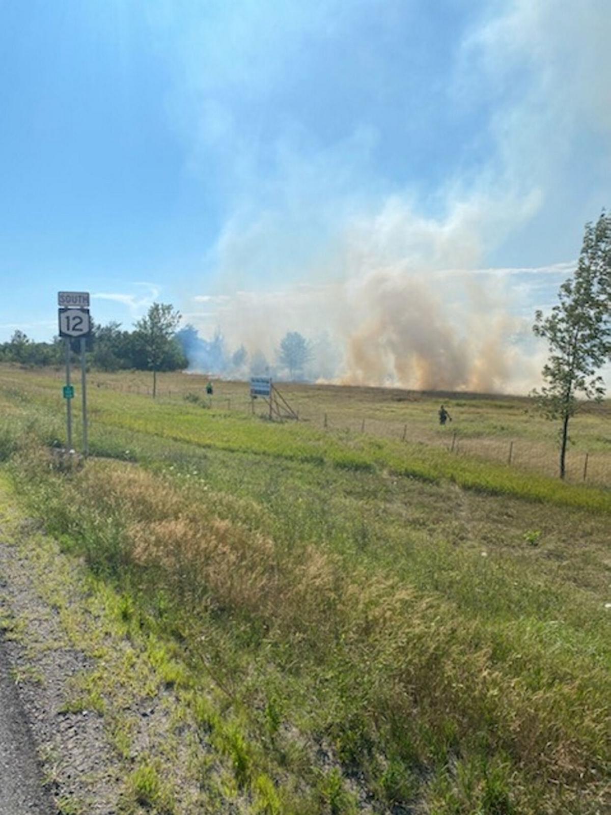 Roughly 100 firefighters spend hours fighting separate brush fires in ...