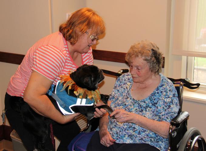 Midnight the pug brings smiles to the faces of RiverLedge residents ...