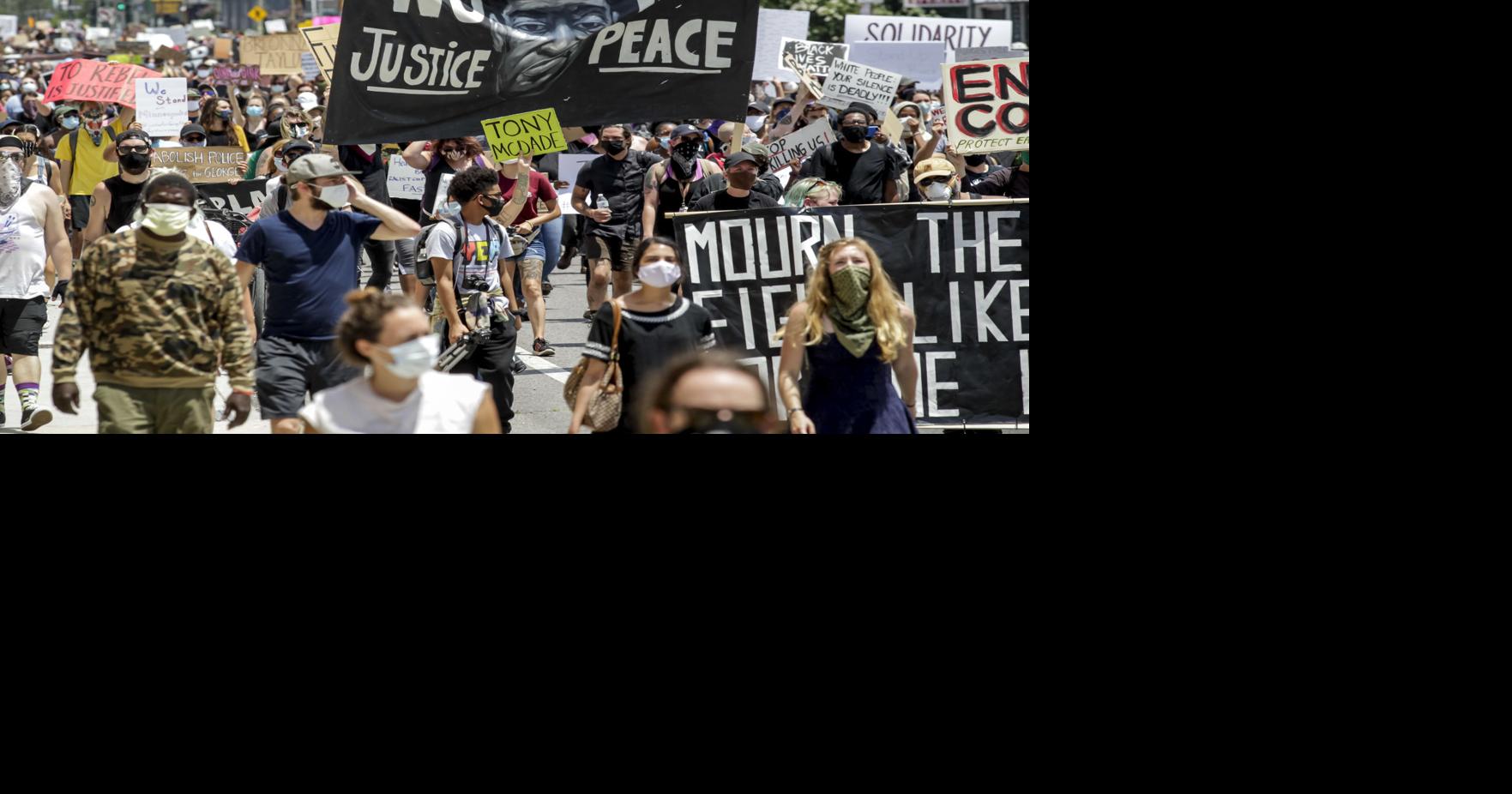 Protesters peacefully march in metro New Orleans in solidarity over ...