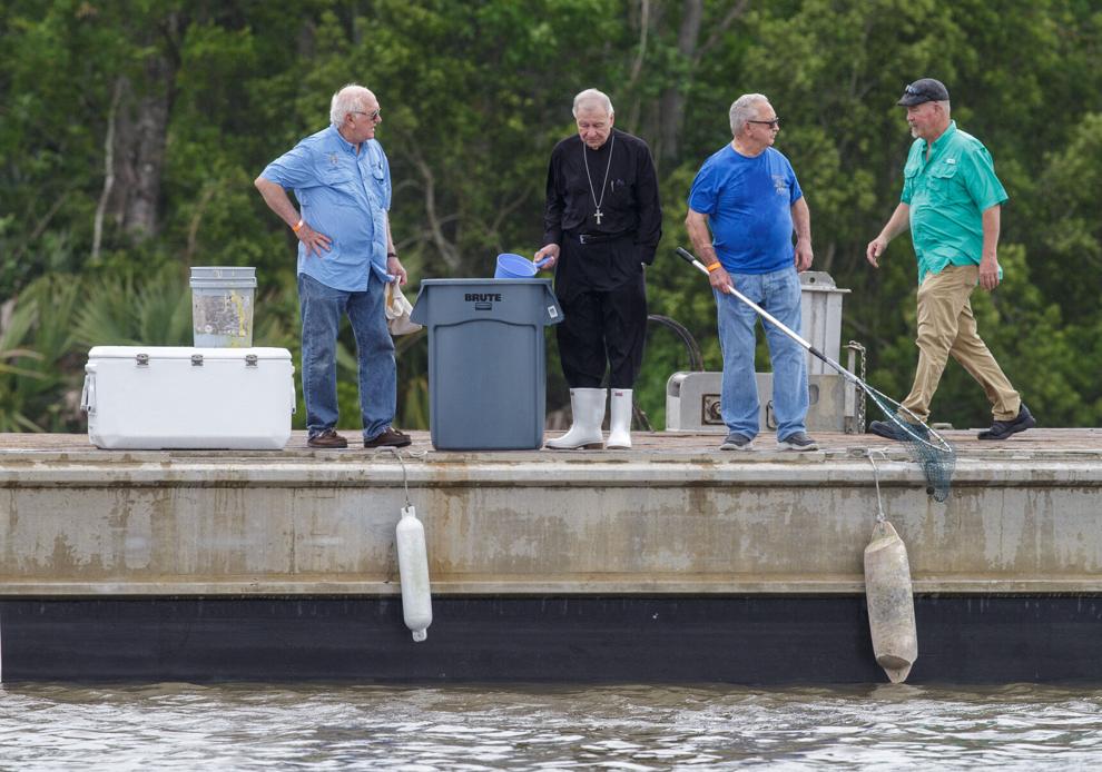 Photos: White shrimp boots, an archbishop, a barge, Holy Water and a ...
