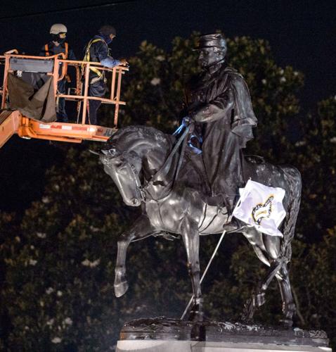 Photos: Tense scene, long night as workers remove PGT Beauregard ...