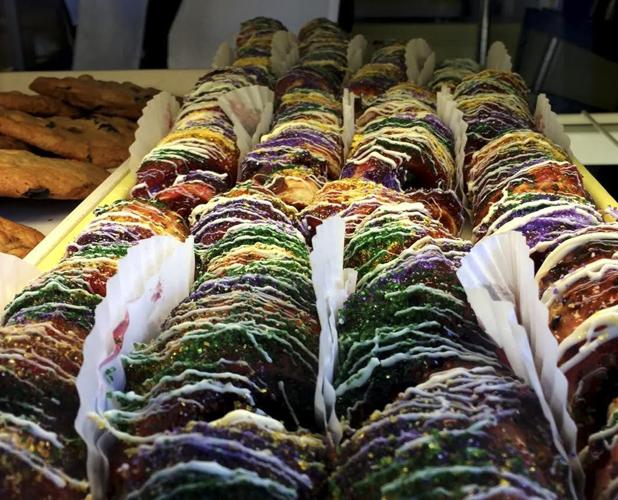 Purple, green and gold everywhere: City flies Mardi Gras colors year ...