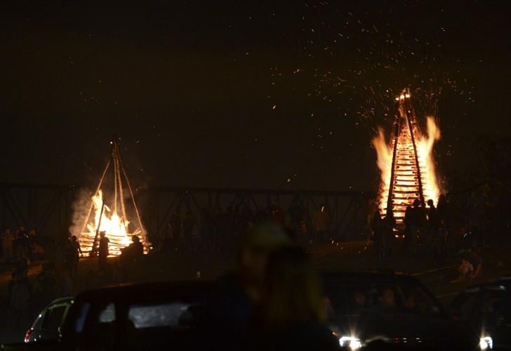 Photos: Bonfires go up along Mississippi River levee on Christmas Eve ...