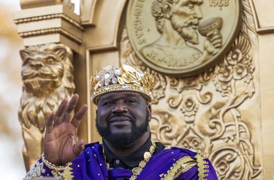 NBA legend Shaq puts his throwing arm to work as king of Bacchus. See ...