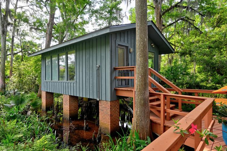 Tucked away on a bayou yet close to Old Mandeville, this home is an ...