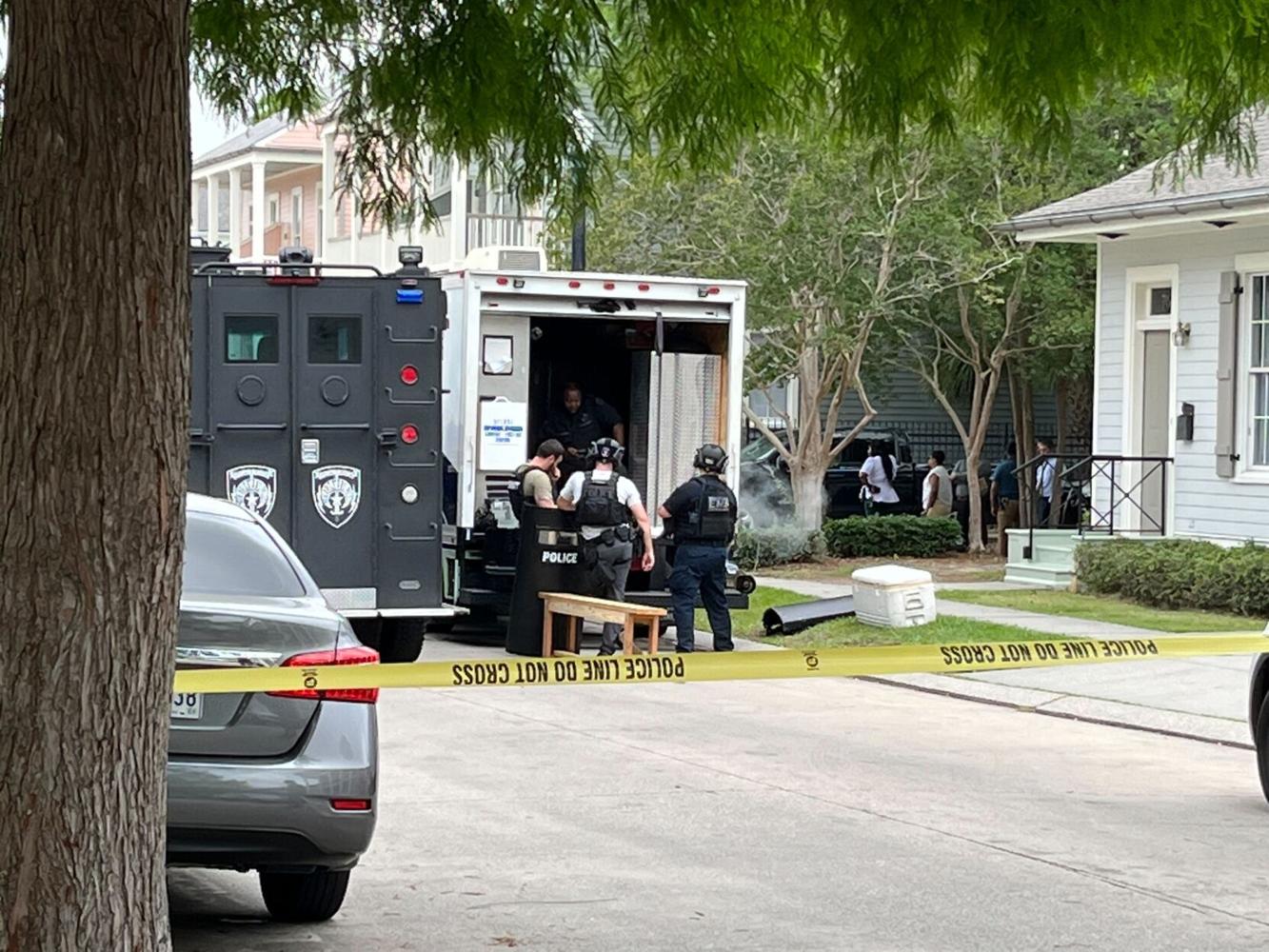 Murder suspect booked after standoff with SWAT team; wanted in shooting ...