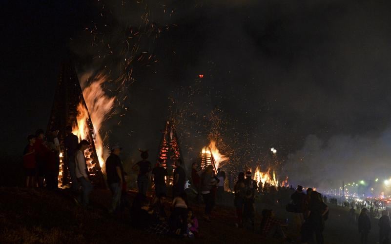 Photos: Bonfires go up along Mississippi River levee on Christmas Eve ...