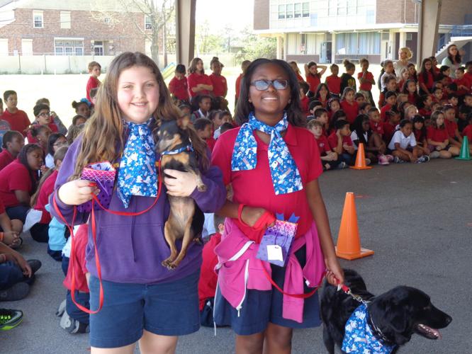 Bissonet Plaza students are rewarded for good behavior with dog show ...