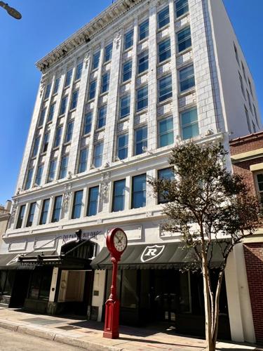 Why does a clock stand in front of the Roumain Building? | Curious ...