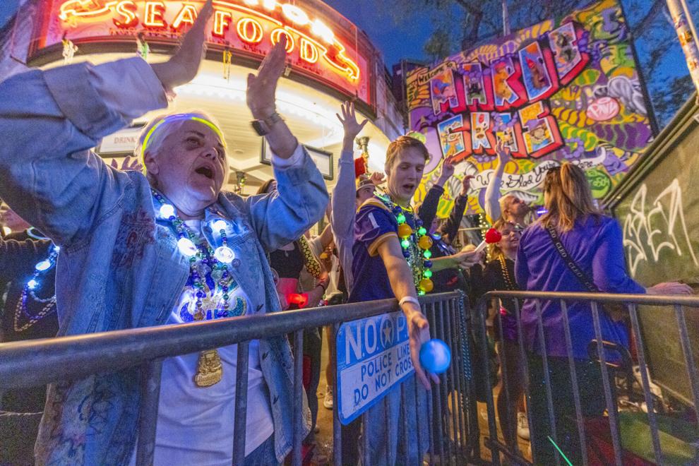 NBA legend Shaq puts his throwing arm to work as king of Bacchus. See ...