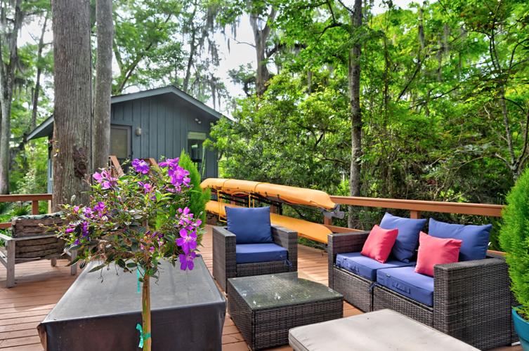 Tucked away on a bayou yet close to Old Mandeville, this home is an ...