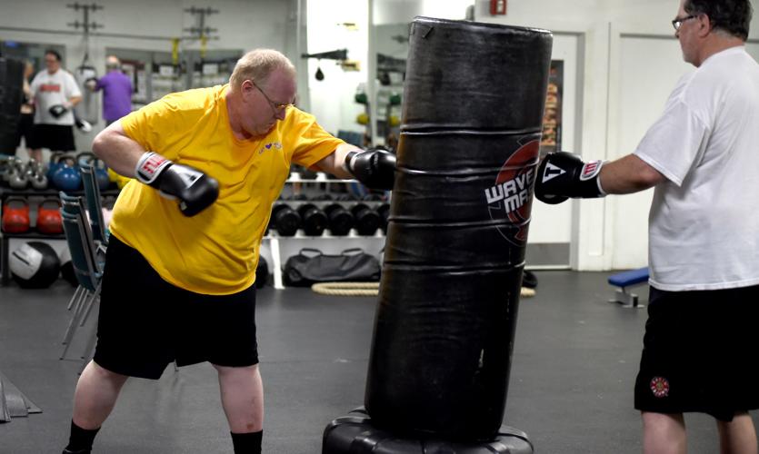 Parkinson's patients fight disease by exercising brain, body at Baton ...