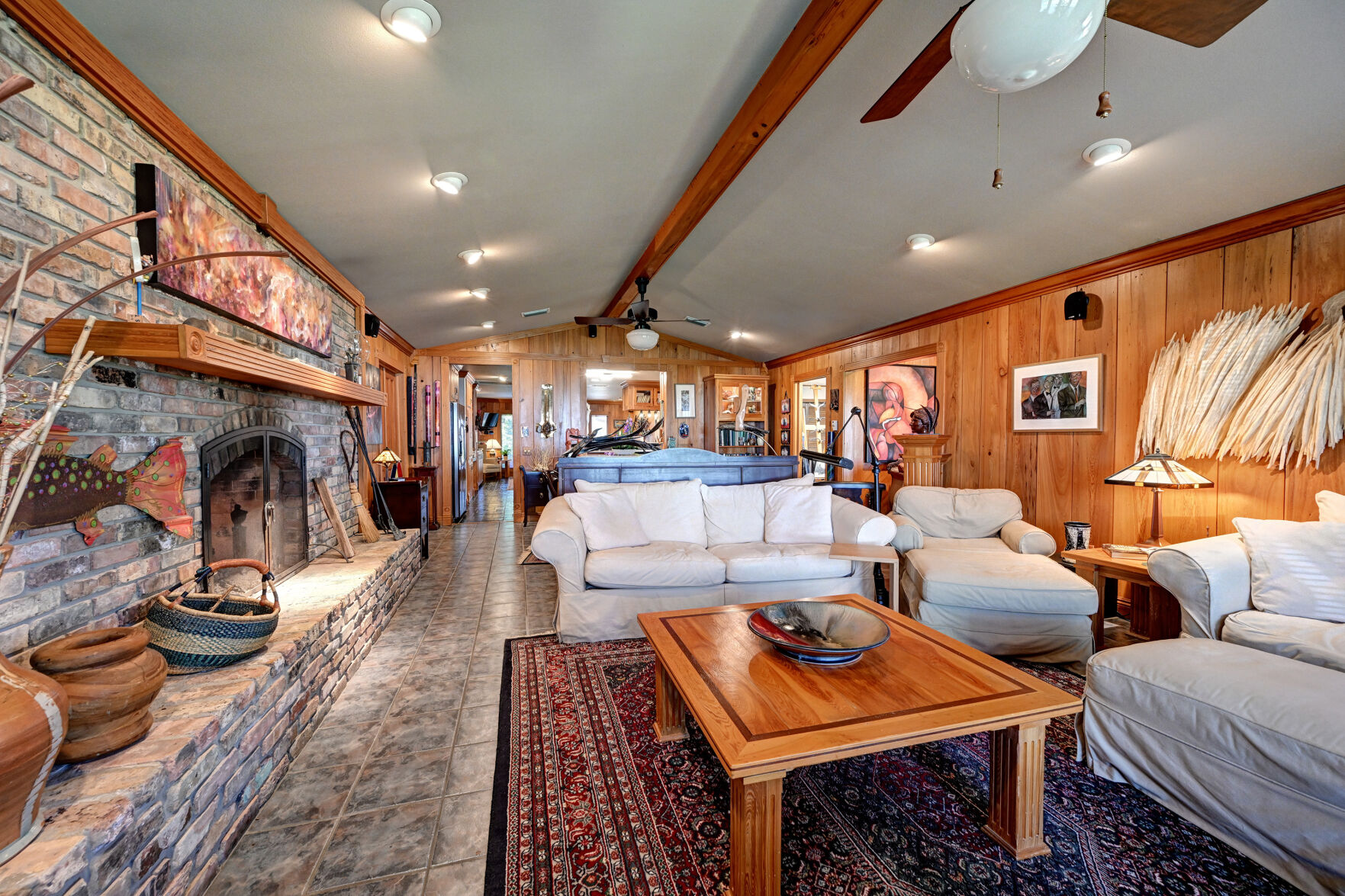 Warm cypress paneling, old St. Joe brick and Louisiana artwork meld in ...