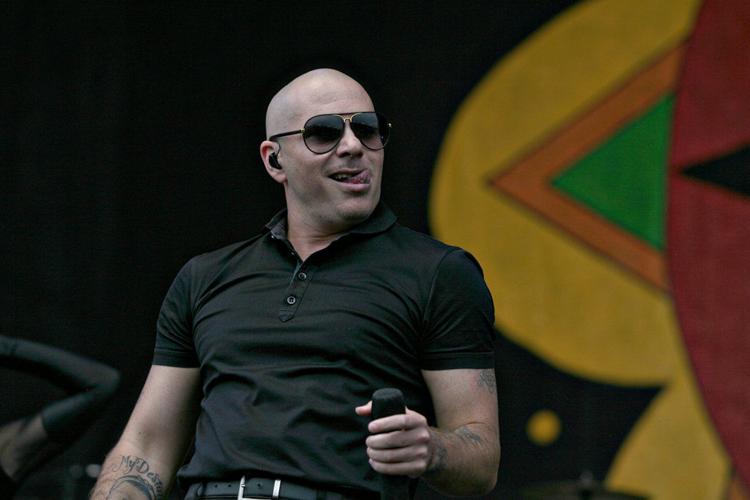Rapper Pitbull hosted a sweaty dance party at the New Orleans Jazz Fest ...