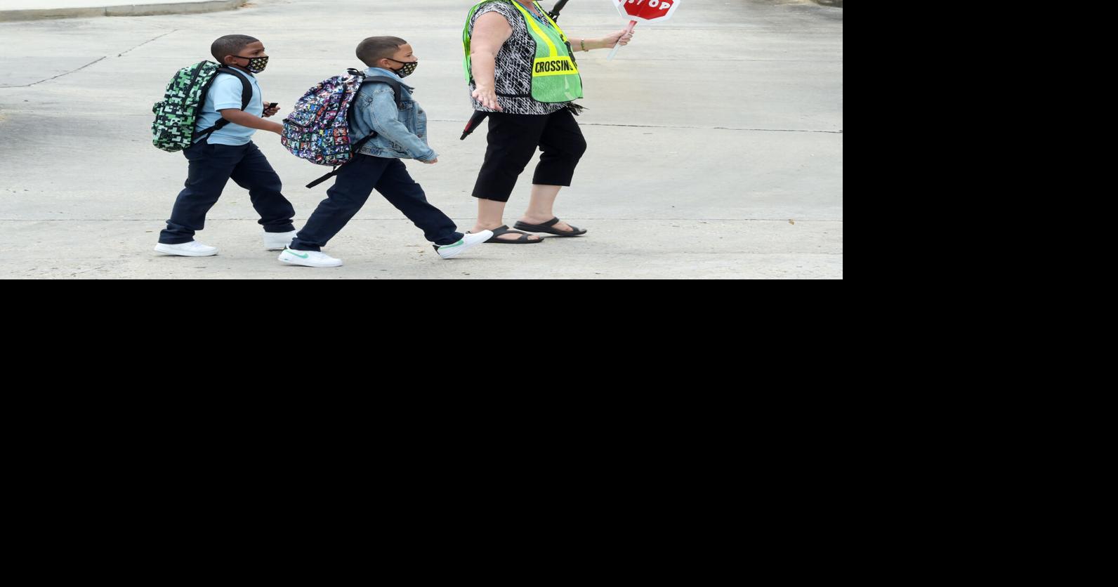 Photos: Parents welcome students after they attend the first day of ...
