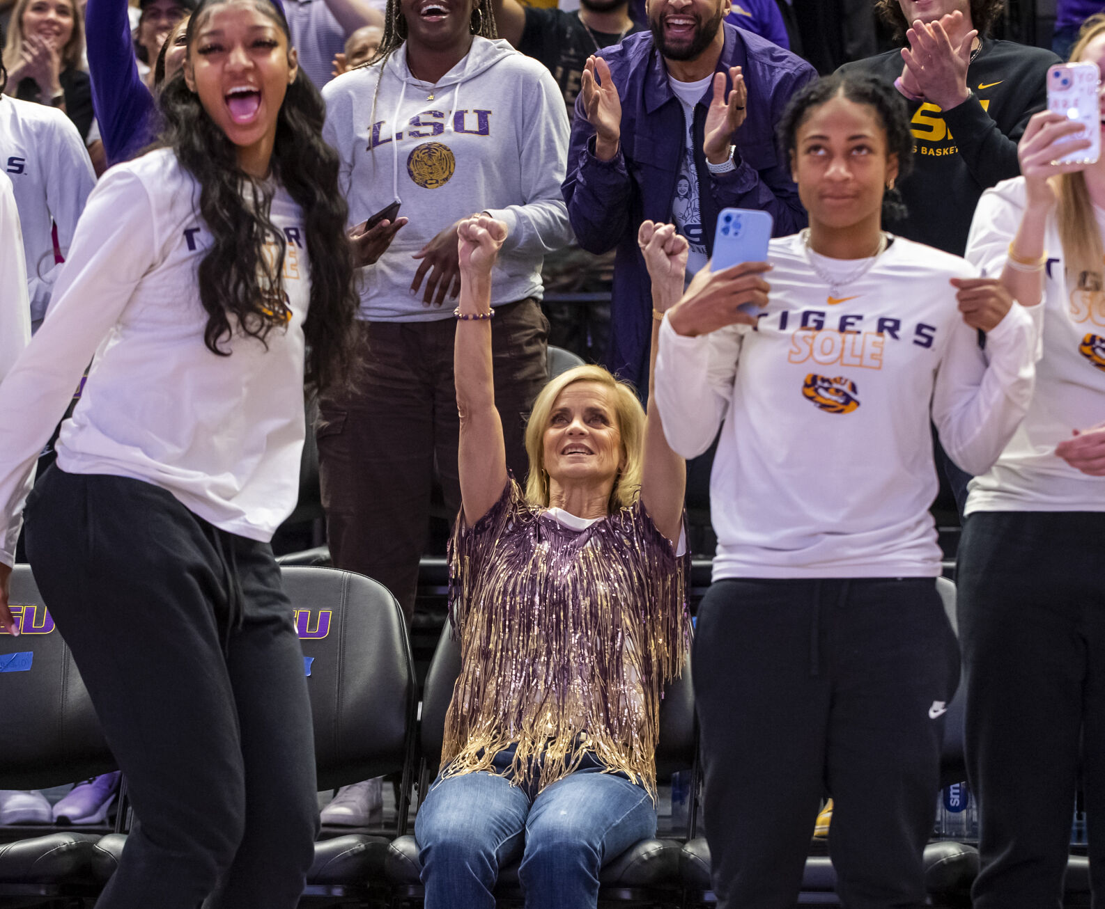 Kim Mulkey and LSU players took over a Raising Cane's drive-thru. Here ...