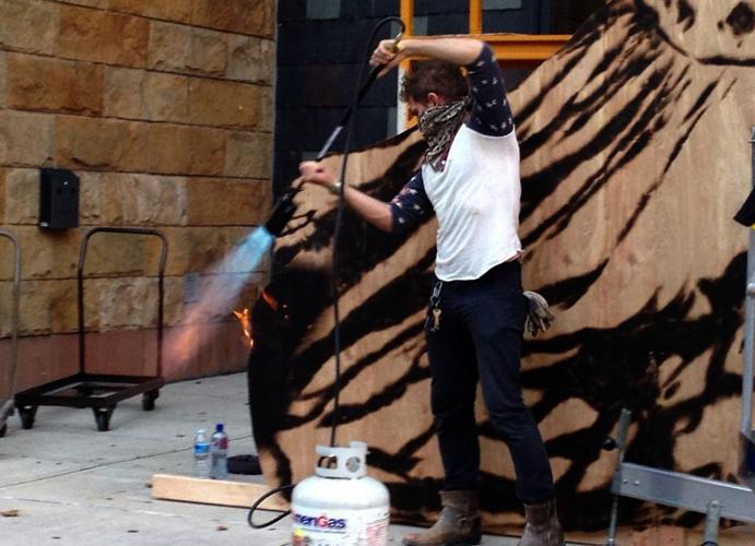 Artist Walker Babington paints giant female nude with fire on Sunday ...