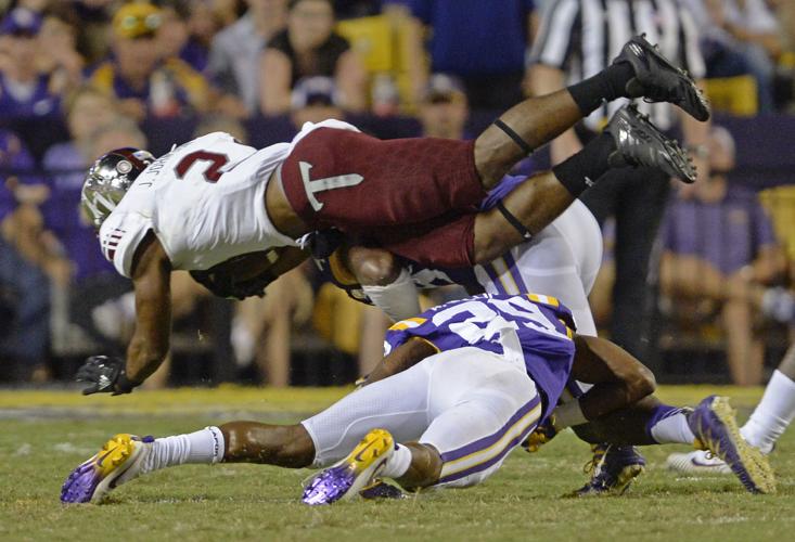 Photos: Troy holds on for massive upset of LSU at Tiger Stadium ...