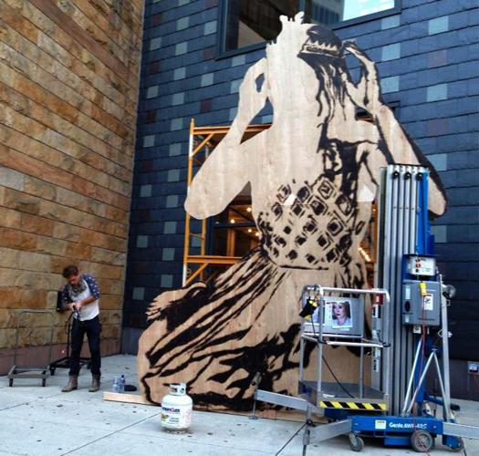 Artist Walker Babington paints giant female nude with fire on Sunday ...