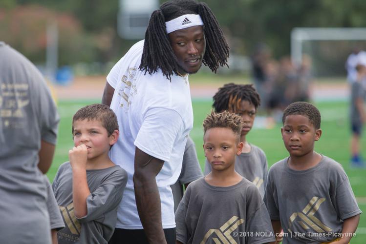 Alvin Kamara puts kids to work at first New Orleans football camp ...