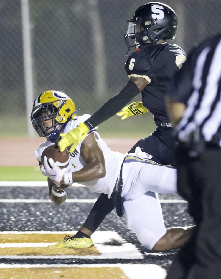 Photos: Covington battles Salmen in preseason football game | Photos ...