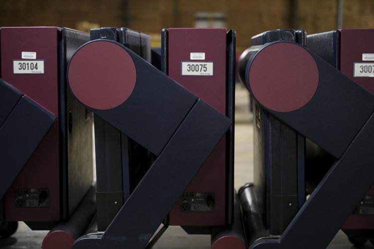 Photos: Election Day Eve, Polling Machines Leave Warehouse for Orleans ...