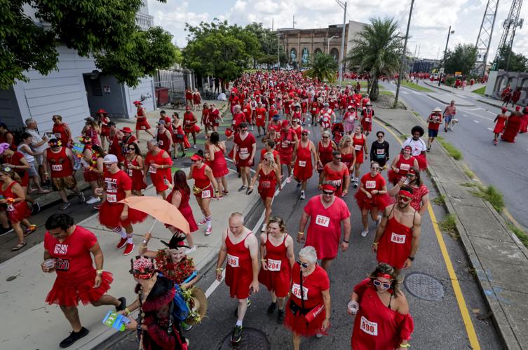 At New Orleans Red Dress Run, some run, some stroll, some just watch ...