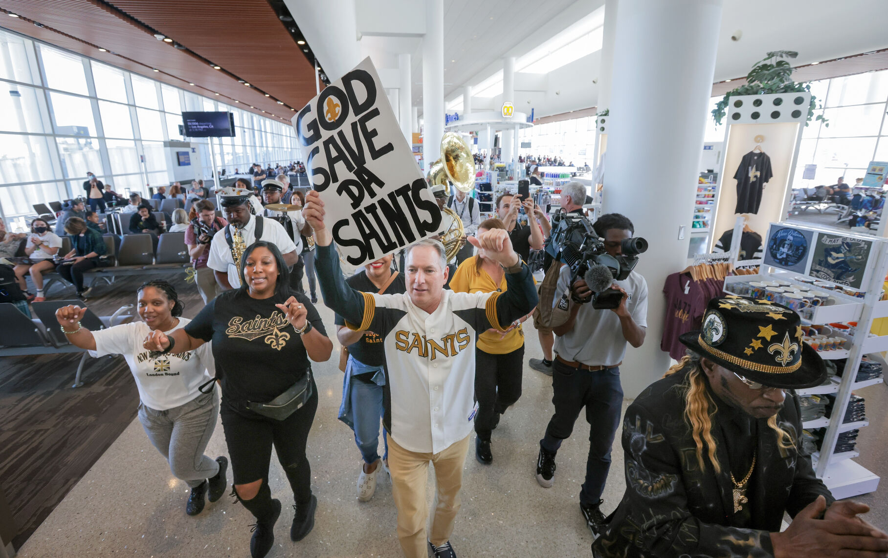 Photos: Saints fans second line at the airport in Kenner | Photos ...