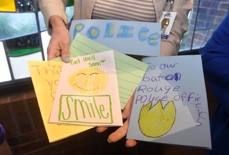 Photos: Community gathers to pray, share hugs, mourn fallen Baton Rouge ...