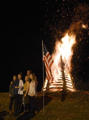 Photos: Bonfires go up along Mississippi River levee on Christmas Eve ...