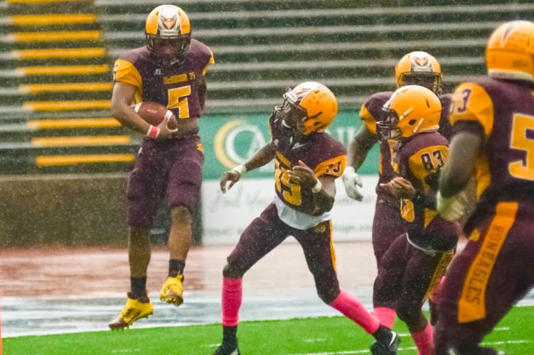 McDonogh 35 overcomes foul weather, Frederick Douglass to earn Wayne ...