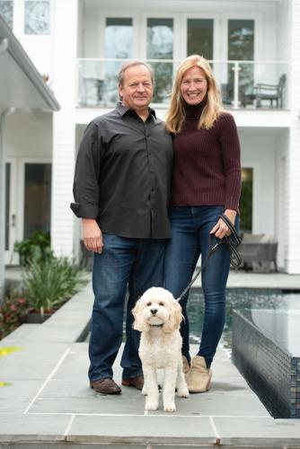 Floor-to-ceiling windows let the indoors and outdoors merge in a sleek ...