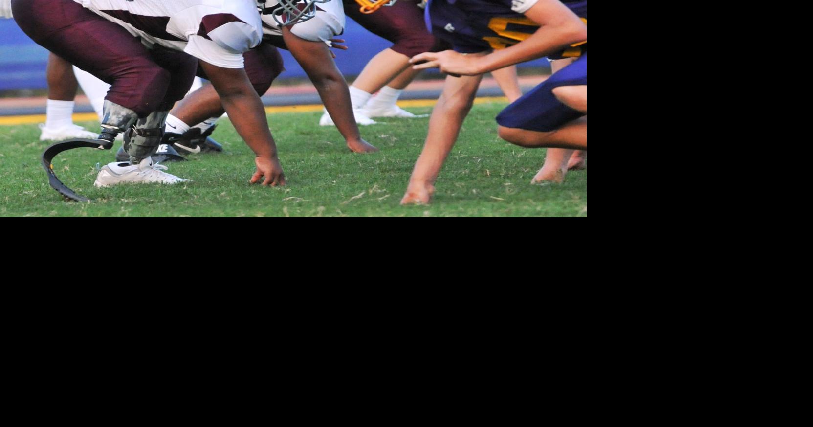 Covington football player with prosthetic legs follows Friday-night ...