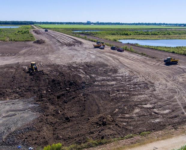 A long-awaited levee is being built. But what about the huge hole in ...