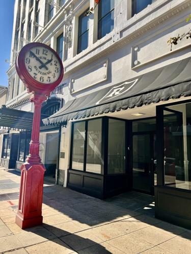 Why does a clock stand in front of the Roumain Building? | Curious ...