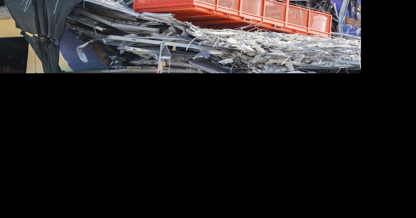 Photos: Family grieves as workers safely remove rubble from the Hard ...