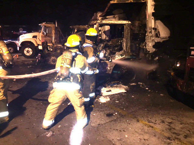 'Smoldering remains' of burned garbage trucks greet firefighters in ...