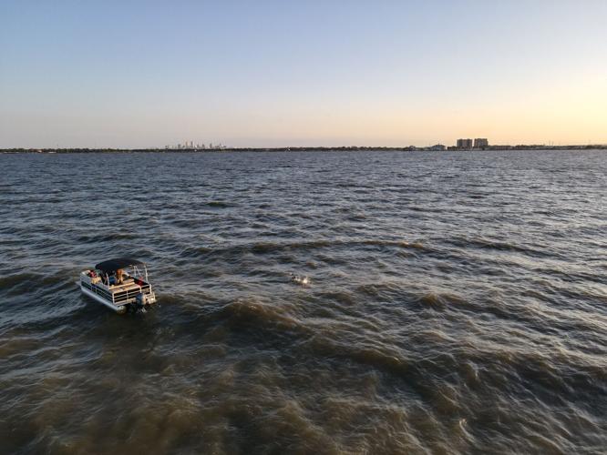Watch: Olympic swimmer, 3 triathletes swim across Lake Pontchartrain as ...