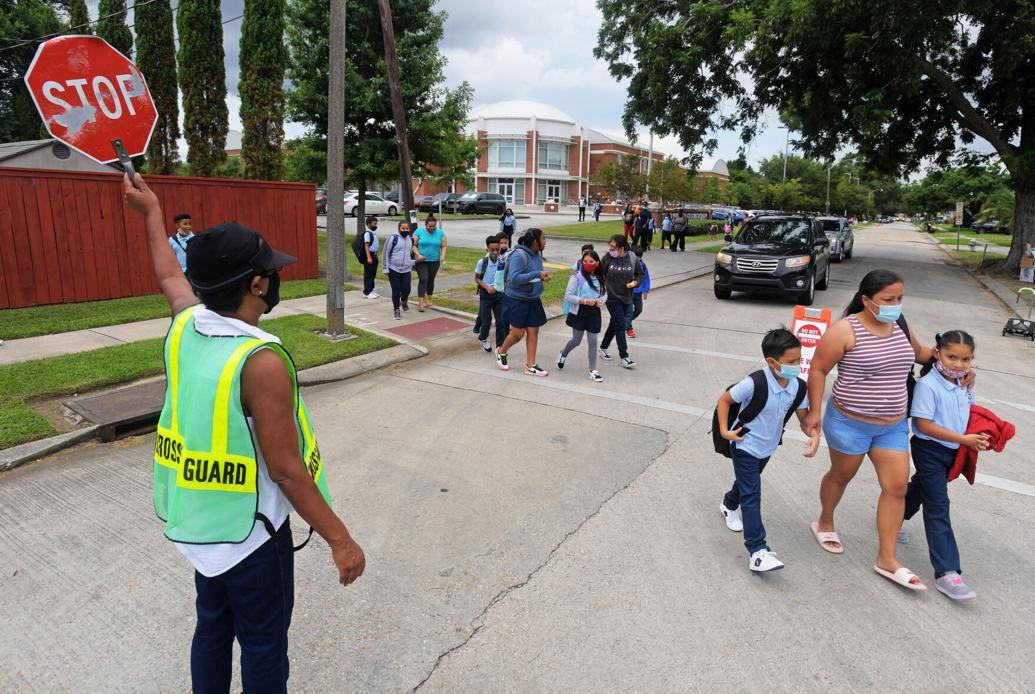 Photos: Parents welcome students after they attend the first day of class at Terrytown ...