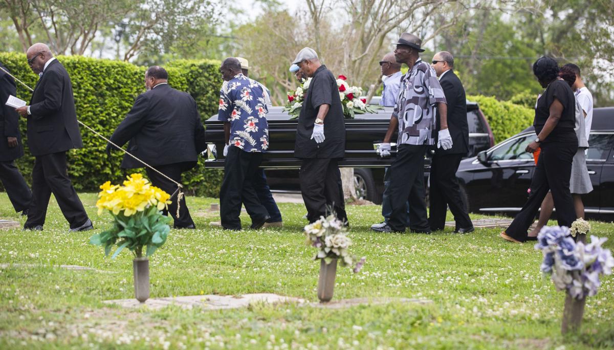 Photos: Funerals forced to downsize; close family of activist Robert ...