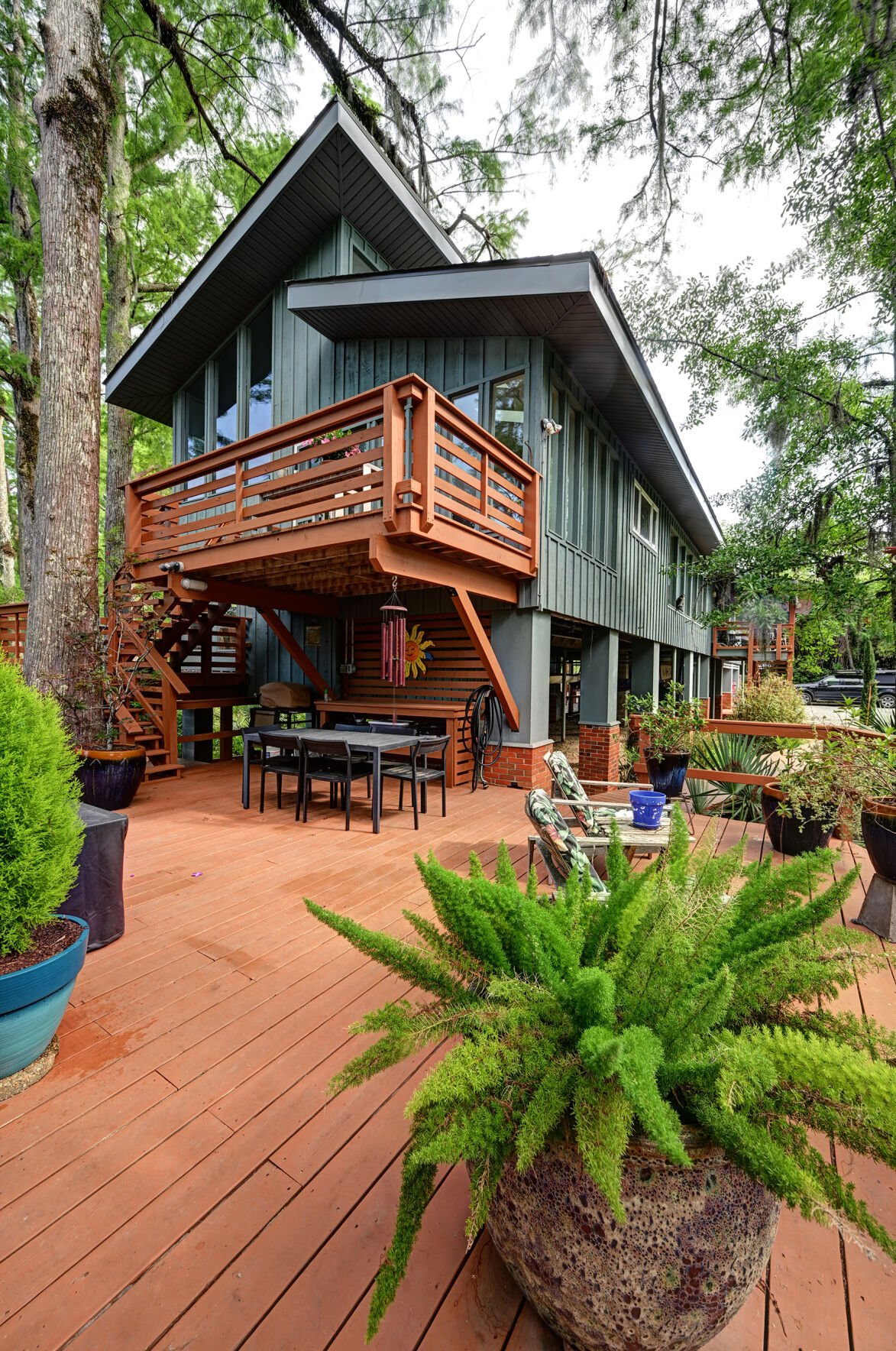 Tucked away on a bayou yet close to Old Mandeville, this home is an ...