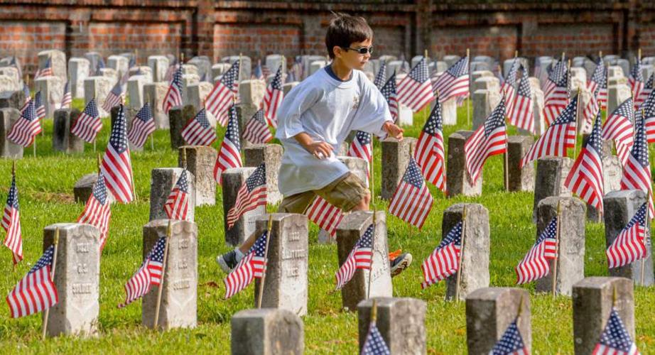 Photos: Boy Scouts, volunteers help plant flags on headstones in ...