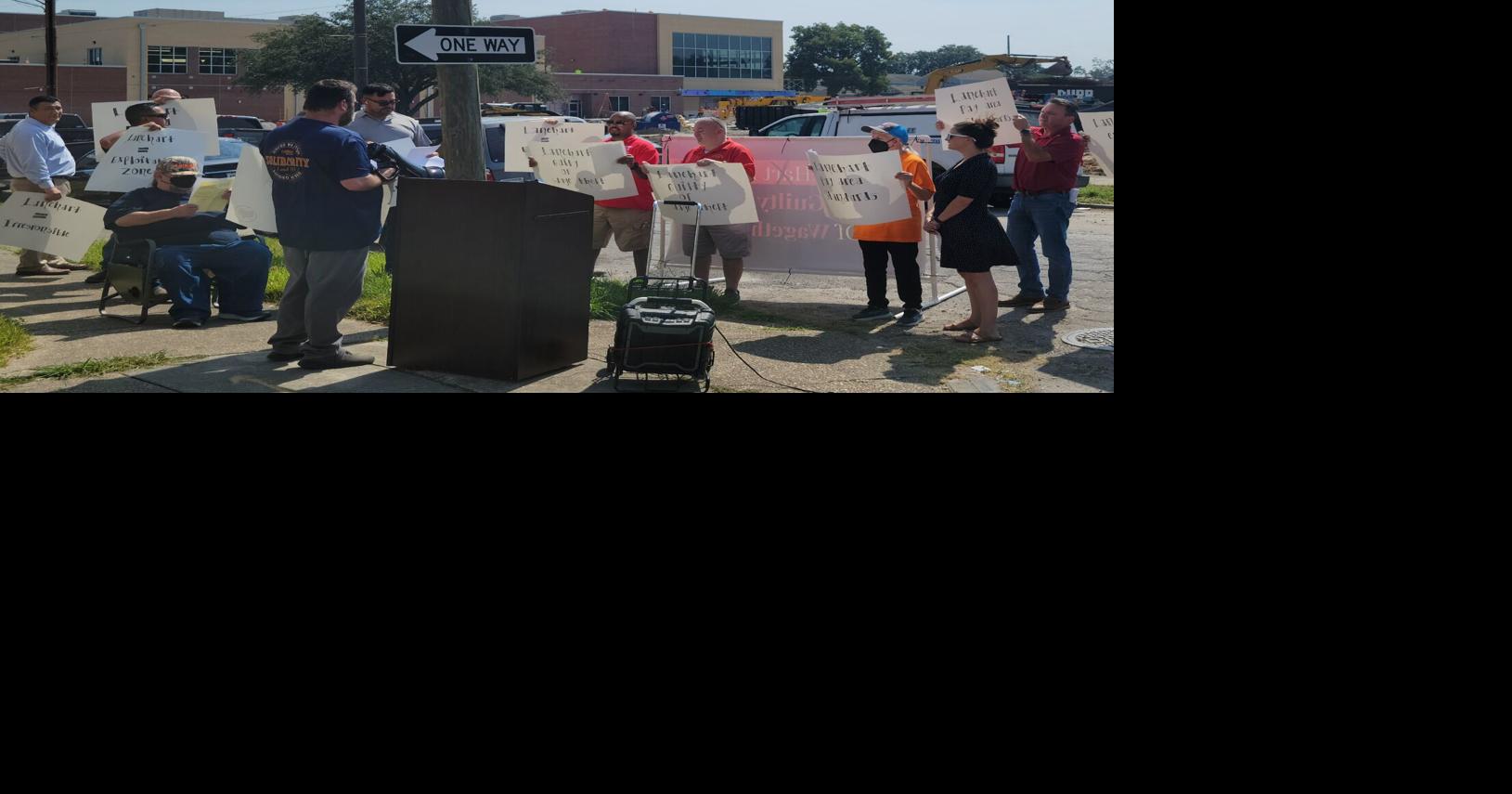 Labor unions protest contractor for continuing alleged "wage theft ...