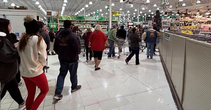 Shoppers brave the cold to wait in line at stores | Select ...