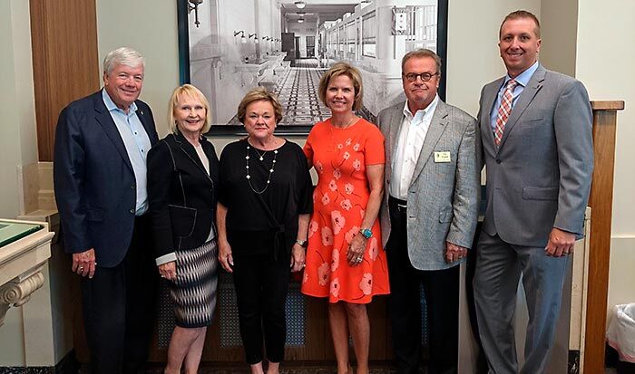 ‘Weight of the world’ returns as bank celebrates renovation | Business ...