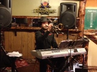 Honky-Tonk Rebel Mario Carboni plays piano and trumpet at Henry Estate ...