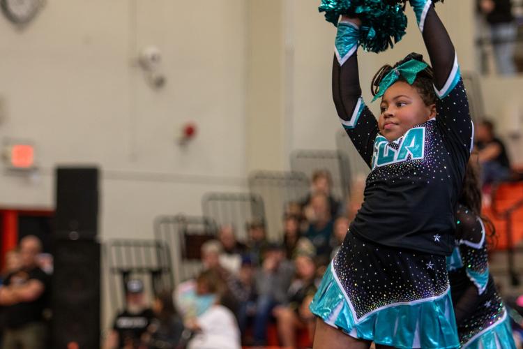 Tumbling, cheering and dancing through the Orange and Black Cheer ...